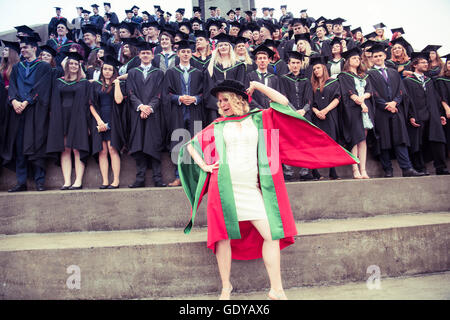 Graduation ceremony doctoral graduates wearing cap and gown in line ...
