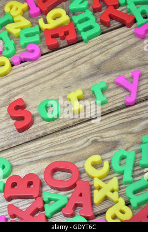 Sorry word on wooden table Stock Photo - Alamy