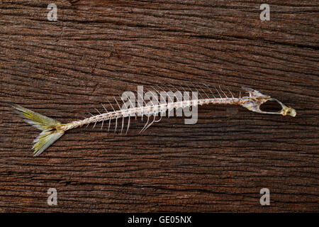 fishbone on old wood background Stock Photo - Alamy