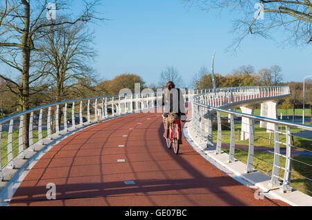 bicyclist using the elevated bike path over the highway Stock Photo - Alamy