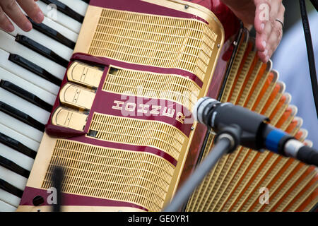 Accordion being played by musician Stock Photo - Alamy