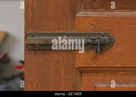 vintage hasp on wood door in house with retro filter - can use to ...