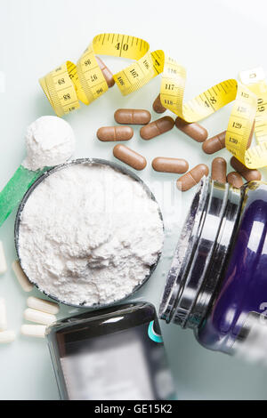 Sports Supplements (creatine capsules) on dark stone background. Close ...