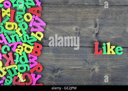 Like word on wooden table Stock Photo - Alamy