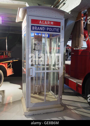 This image captures a telephone booth in Curitiba, Brazil, reflecting ...