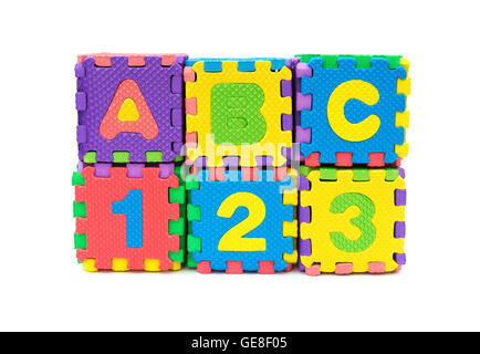 A stack of alphabet puzzle blocks on white background Stock Photo - Alamy