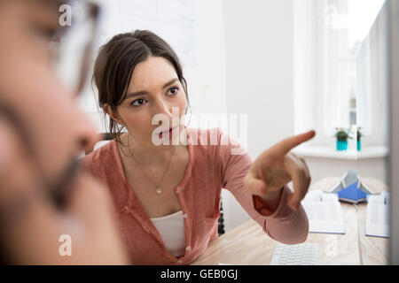 Two creative professionals working in office Stock Photo - Alamy