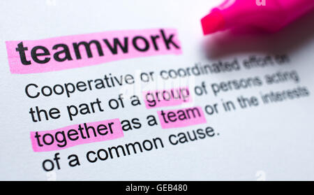 Definition of teamwork, highlighted in colour Stock Photo - Alamy