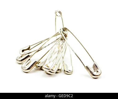 Two silver safety pins on white background, open safety pin on left, closed safety pin on right ...