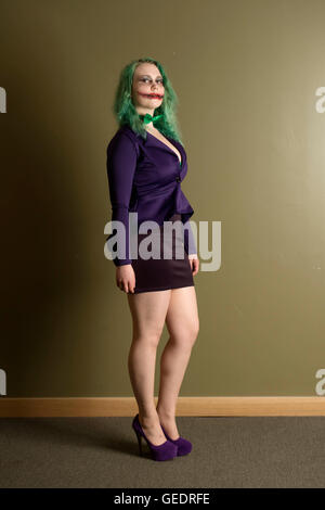 A girl dressed as a Halloween character poses for a photo during the ...