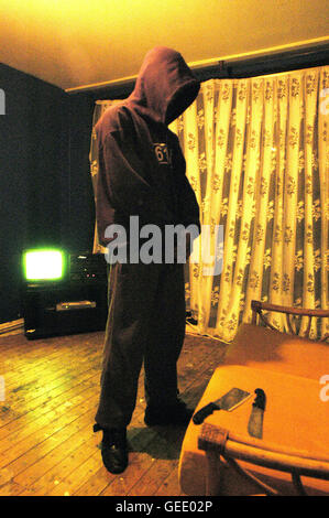 A member of the 'Muslim Boys' gang pictured in a safe house in Peckham ...