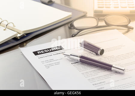 Resume information, pen, digital tablet, notebook, and glasses Stock ...