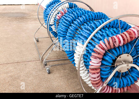 Swimming lanes markers in reel storage inside the pool. Pool lane lines ...