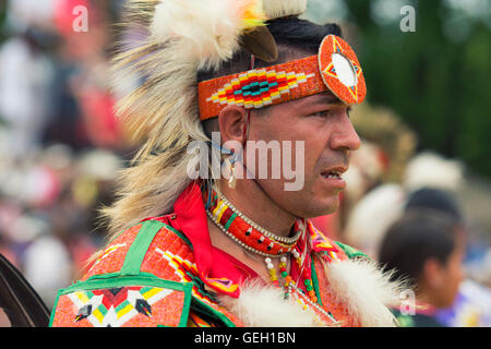 First Nations dancer in traditional dress, at a pow wow ceremony ...
