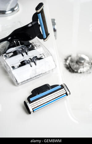 closeup new multiple blade razor on white background Stock Photo - Alamy