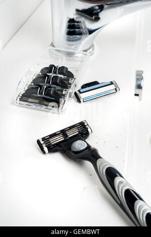 closeup new multiple blade razor on white background Stock Photo - Alamy