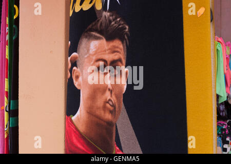 National hero, footballer Christiano Ronaldo's distorted face on beach ...