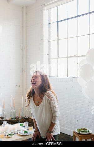 Side view of a woman laughing Stock Photo - Alamy