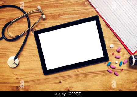 Tablet computer with accessories of doctor on color background Stock ...
