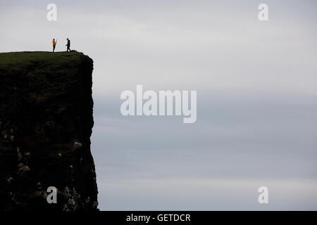 People silhouetted on a cliff, Hafnaberg, Iceland Stock Photo - Alamy