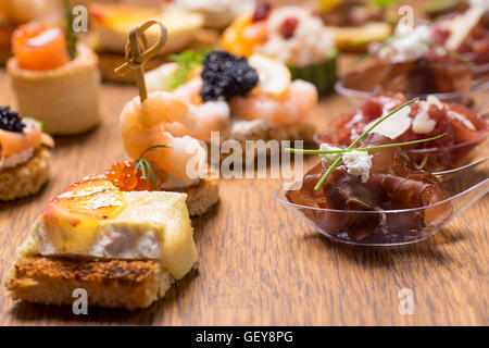 Exquisite selection of luxury canapes, appetizer ready to be served for ...