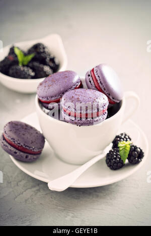 White meringue cookies on a wooden board with coconut powder Stock ...