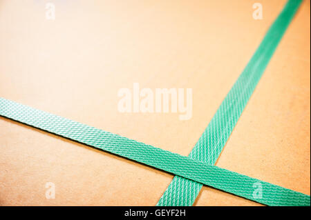 freight parcel with plastic strap background Stock Photo - Alamy