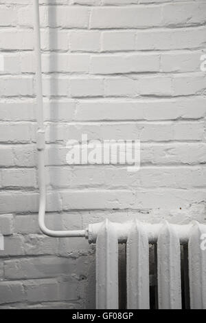 white brick wall with radiator Stock Photo - Alamy