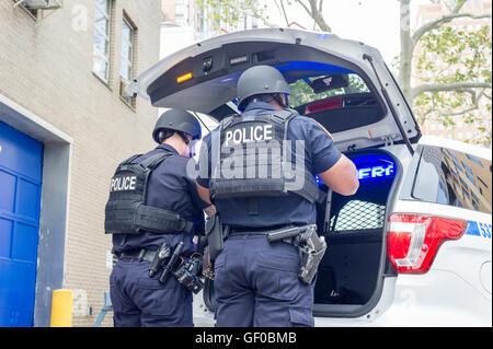 Police Officers wearing body armor patrol the street, Independence ...