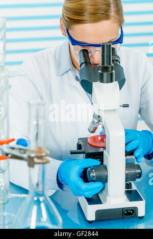 Closeup of young African doctor examining ct scan of patients cranium ...