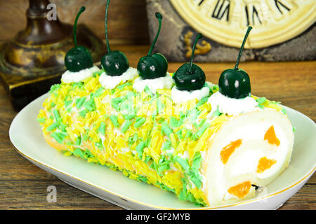 Sponge Roulade with Cream, Mandarin and Cherry Stock Photo - Alamy