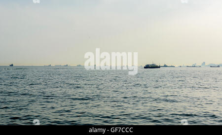 accumulation of cargo ships in the sea on the horizon during a queue ...