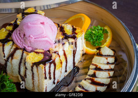 Honey toast and banana wtih dry ice on table background Stock Photo - Alamy