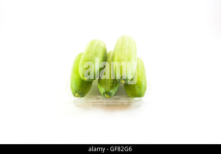 Five green cucumbers stack in plastic tray on white background Stock ...