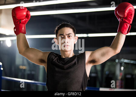 Chinese boxer cheering in boxing ring Stock Photo - Alamy