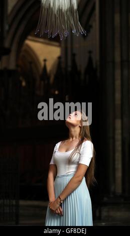 Salisbury Cathedral employee Lottie Pedder looks at the exhibit ...