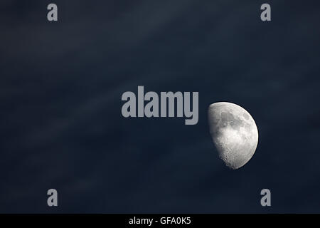 The moon is in a dark cloudy sky. Abstract Halloween background Stock ...