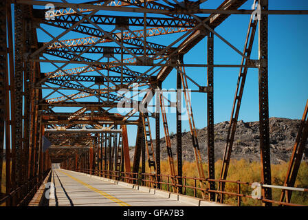 Rusty old steel bridge crossing river in southwest desert Stock Photo ...
