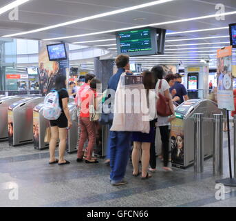 People commute at Orchard MRT station in Singapore Stock Photo - Alamy