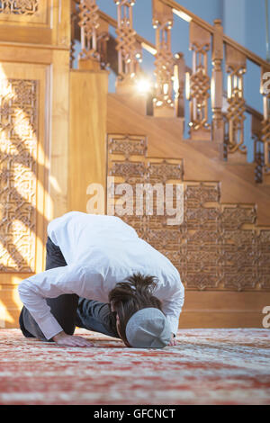 Religious muslim man praying, steps of praying Stock Photo - Alamy