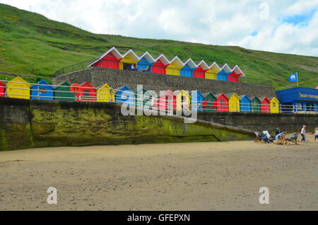 Multi-coloured beach huts at Whitby Beach, Whitby, Yorkshire, England ...