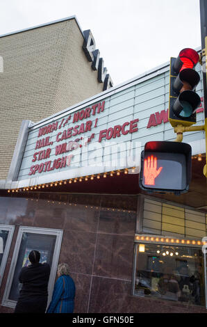 Vertical marquee sign on historic theater building against blue sky ...