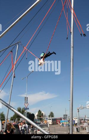 Girl kid jumping on trampoline with autumn leaves. Bright yellow orange ...