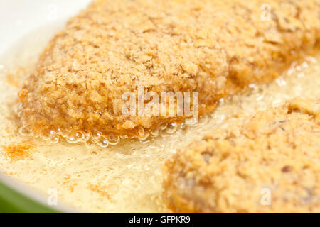 Frying a cordon bleu Stock Photo - Alamy