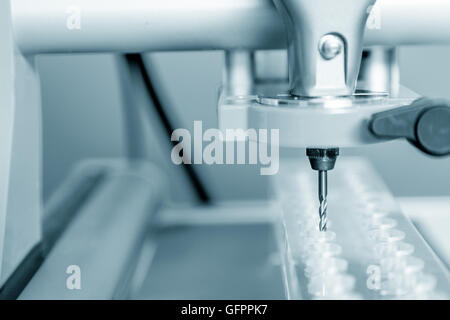 CNC turning lathe machine with a control panel in the foreground ...