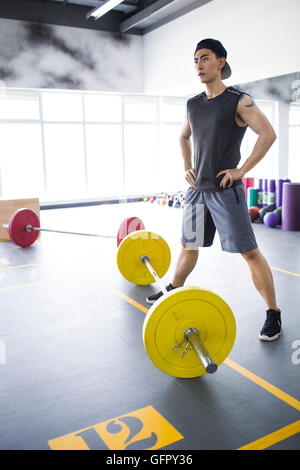 Athlete standing with wide legs apart at sports field Stock Photo - Alamy