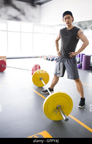 Athlete standing with wide legs apart at sports field Stock Photo - Alamy