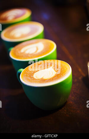 Cups of coffee with patterns in the froth on the top Stock Photo - Alamy
