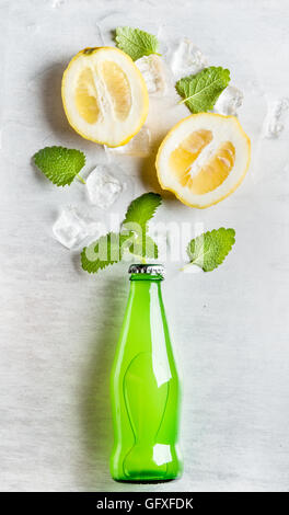 Lemonade with lime and ice cubes on white background Stock Photo - Alamy