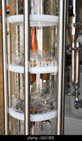 Bubble plate still with metal structure and glass walls filled with ...